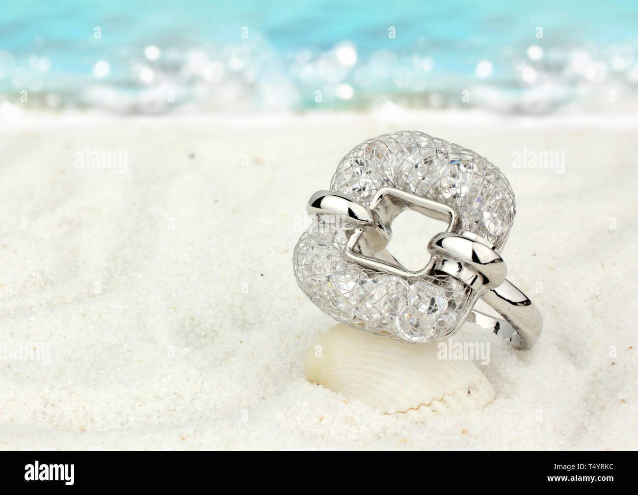 Jewelry ring on sand beach as background Stock Photo - Alamy