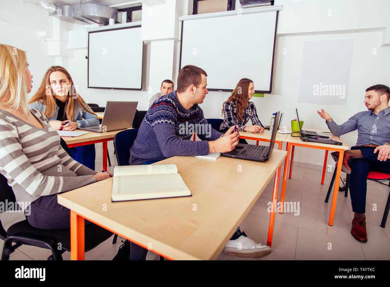 Students are in classroom, they are listening to a lecture Stock Photo ...
