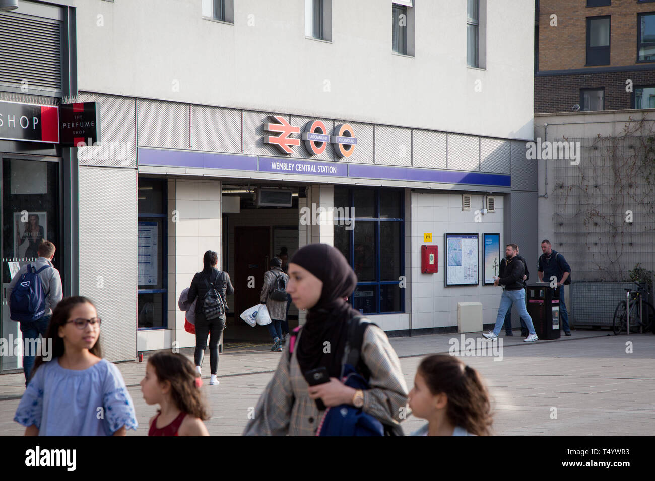 Wembley Central Station entrance on High Road, Wembley busy with ...