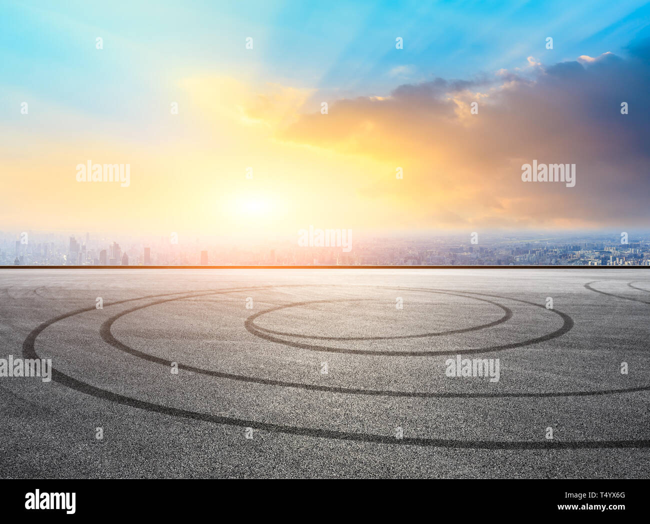 Shanghai city skyline and asphalt race track ground scenery at sunrise ...