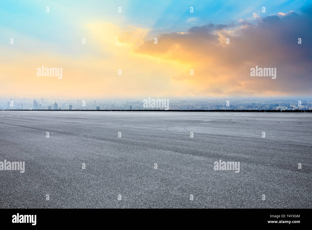 Shanghai city skyline and asphalt race track ground scenery at sunrise ...