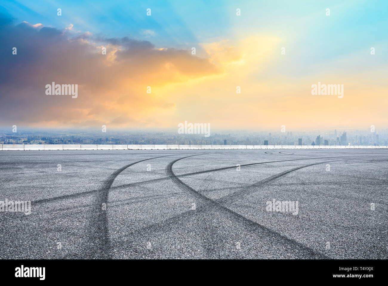 Shanghai city skyline and asphalt race track ground scenery at sunrise ...