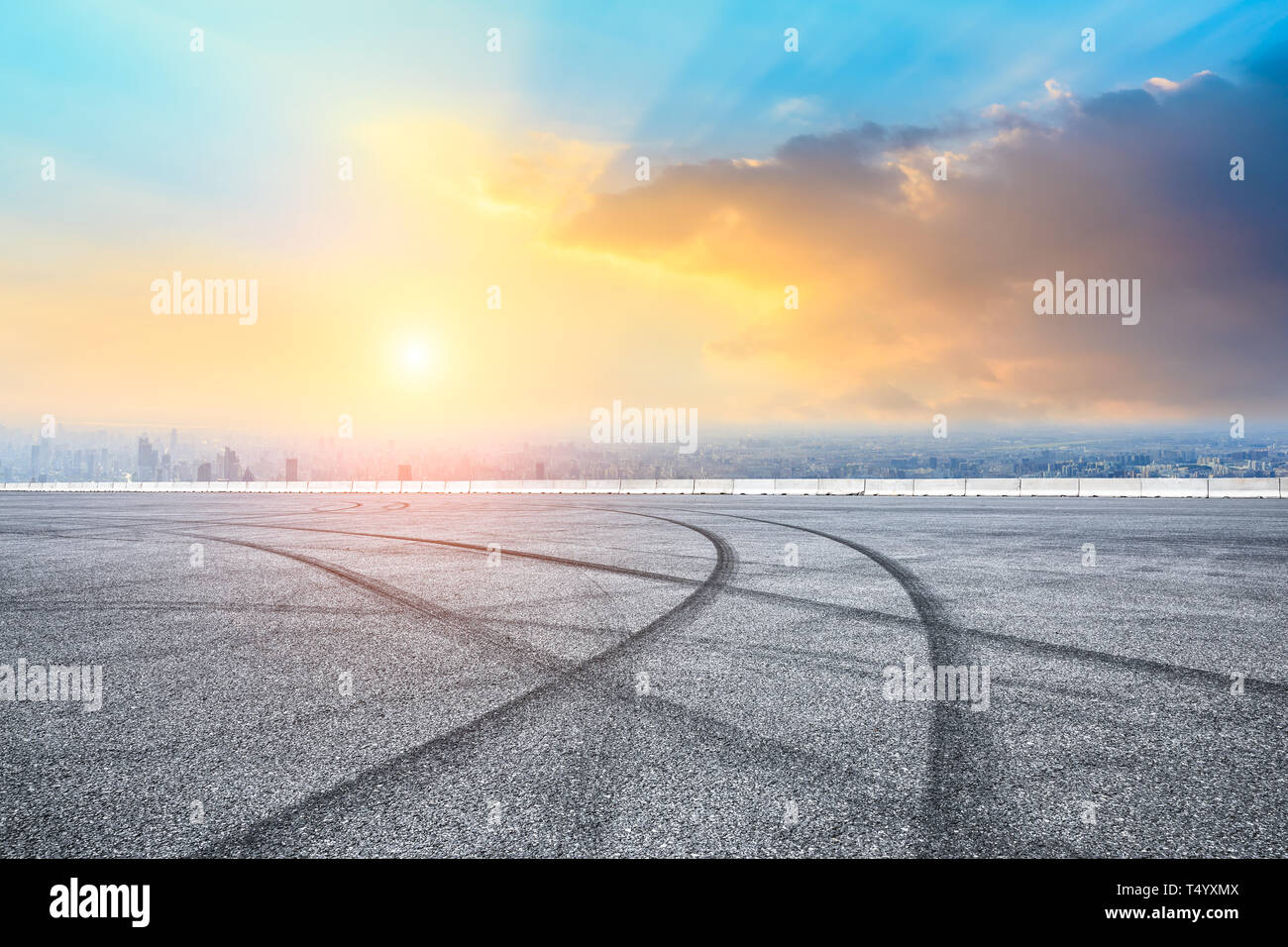 Shanghai city skyline and asphalt race track ground scenery at sunrise ...