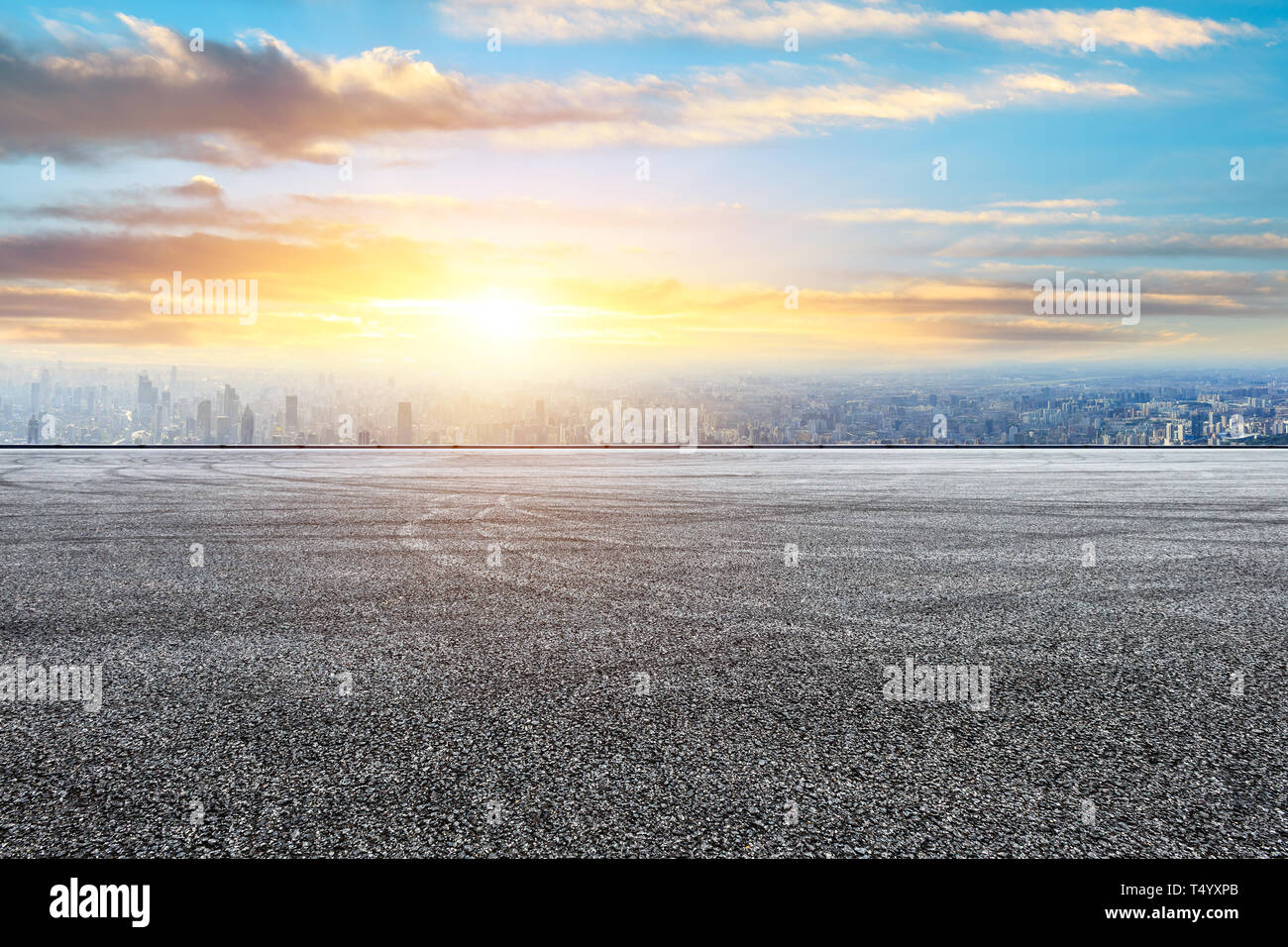 Shanghai city skyline and asphalt race track ground scenery at sunrise ...