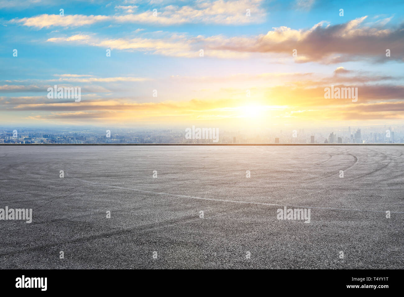 Shanghai city skyline and asphalt race track ground scenery at sunrise ...