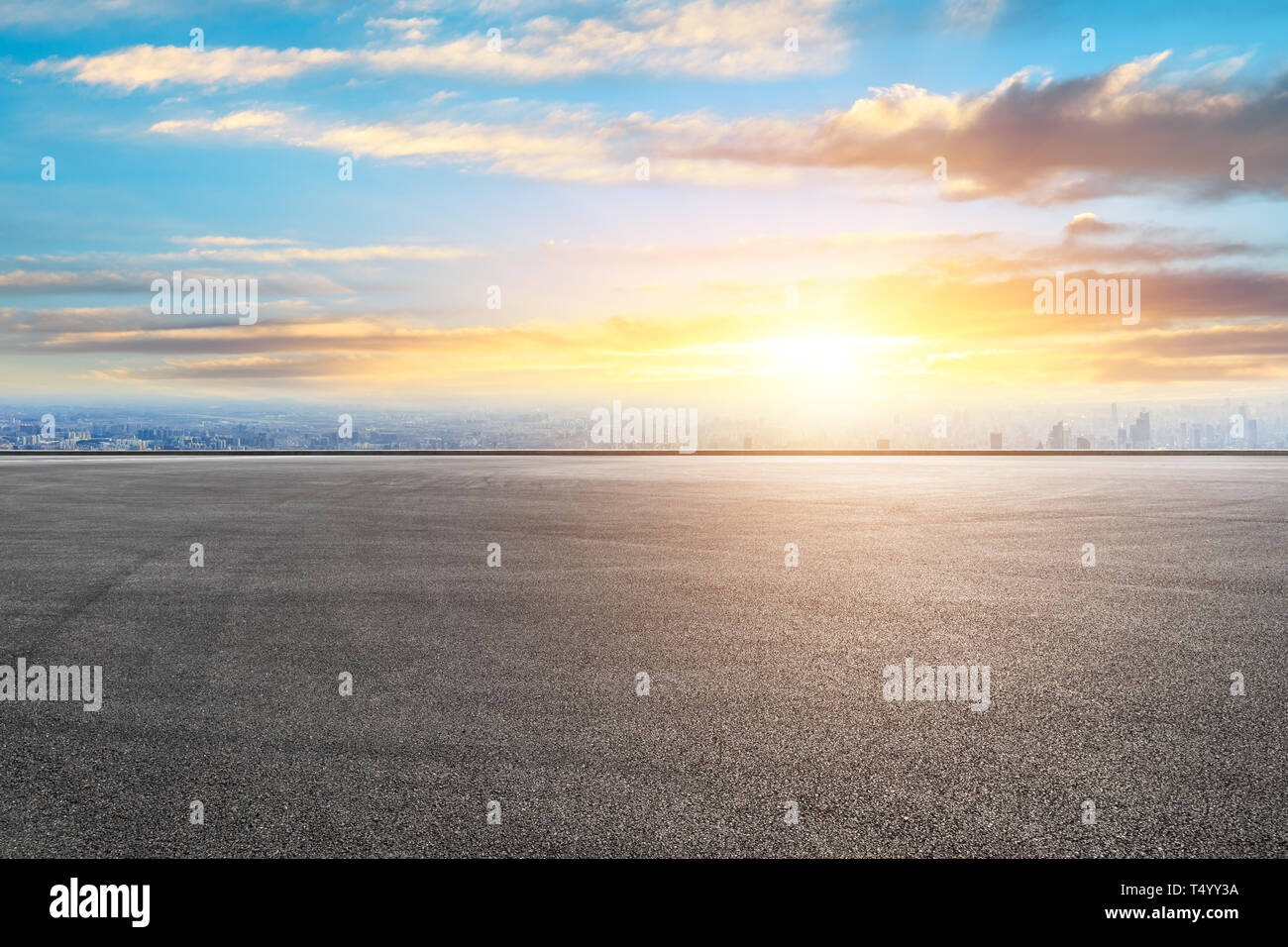 Shanghai city skyline and asphalt race track ground scenery at sunrise ...