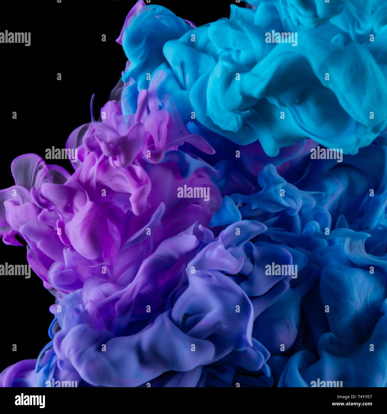 blue and purple ink in water Stock Photo - Alamy
