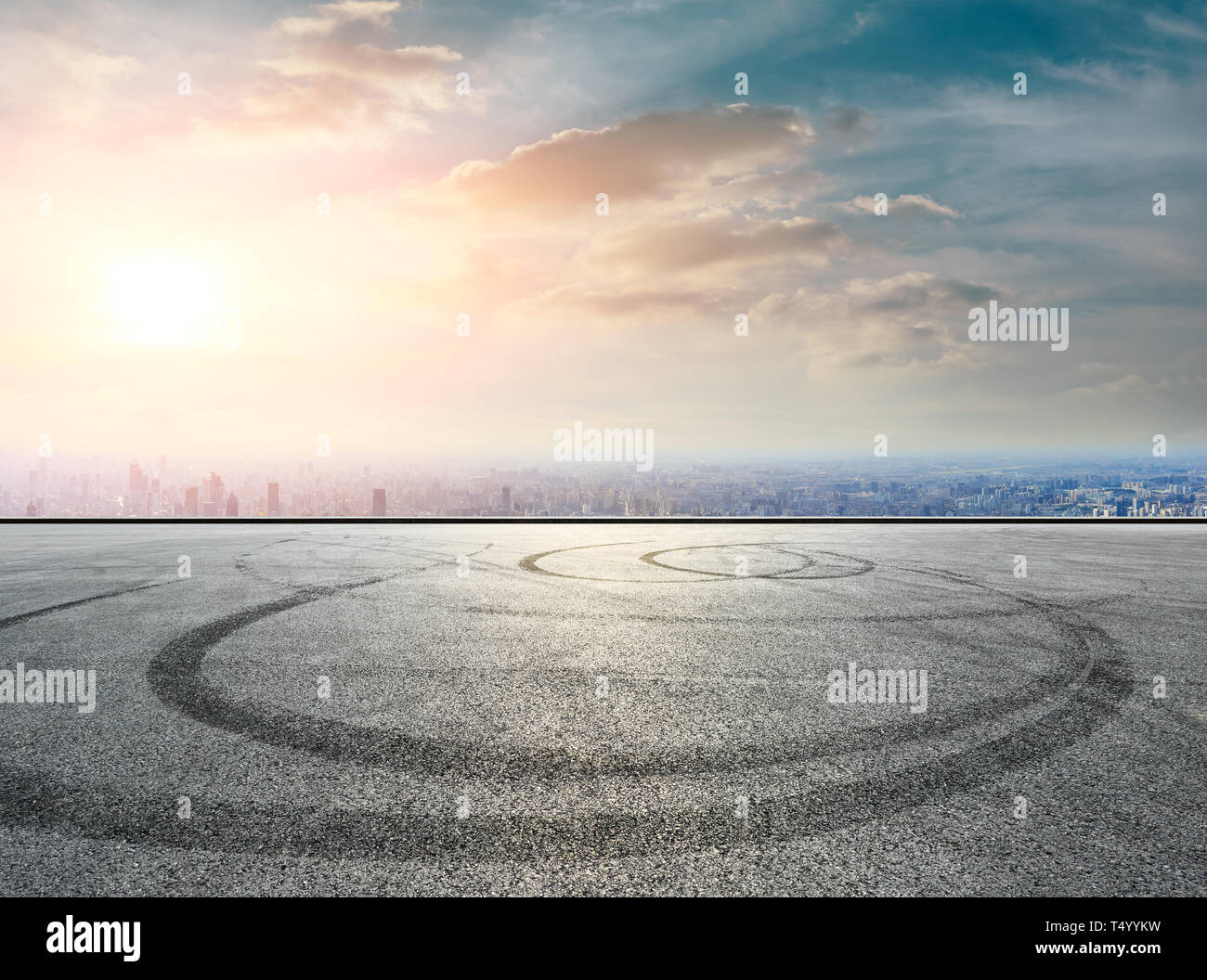 Shanghai city skyline and asphalt race track ground scenery at sunrise ...