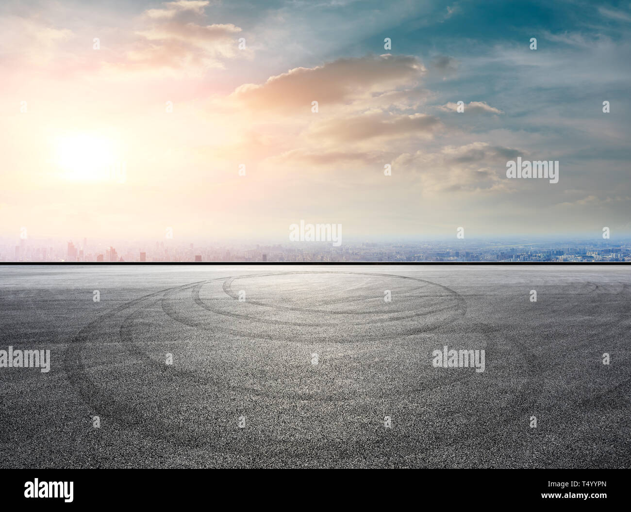 Shanghai city skyline and asphalt race track ground scenery at sunrise ...