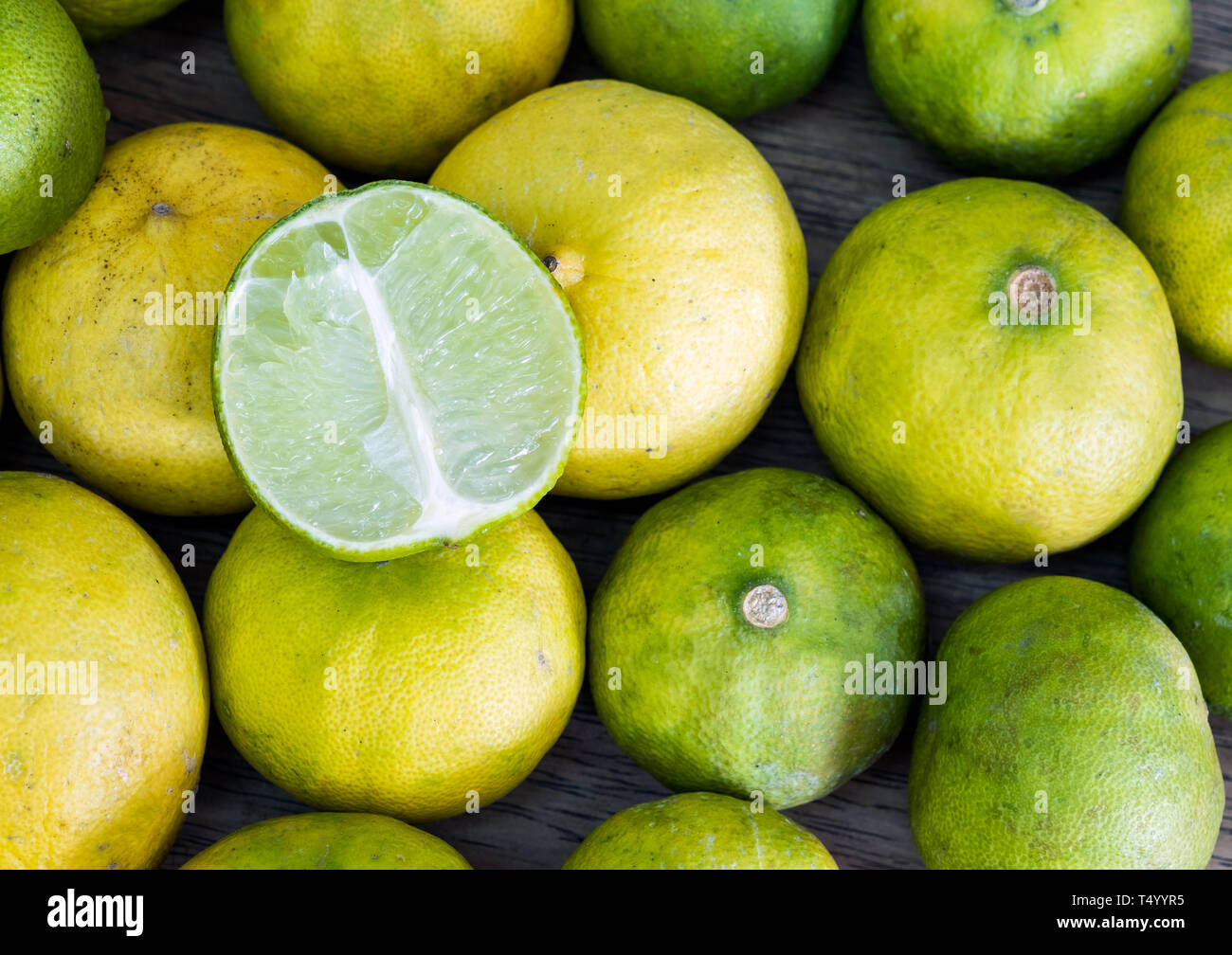 Lemon lime ripe slice half on pile Stock Photo - Alamy