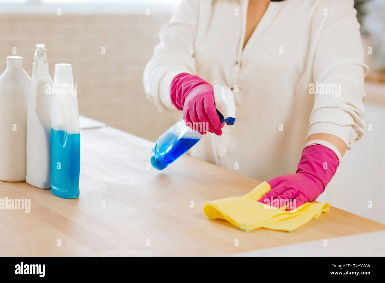 Cleaning process. Close up of a wiper being in female hands while being ...