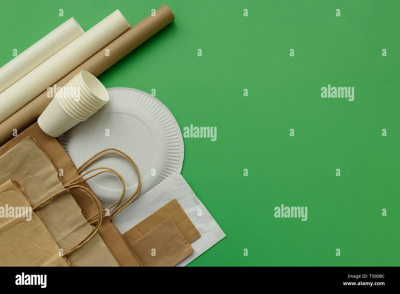 Paper packages on green background. Copy space. Top view. Eco and save ...