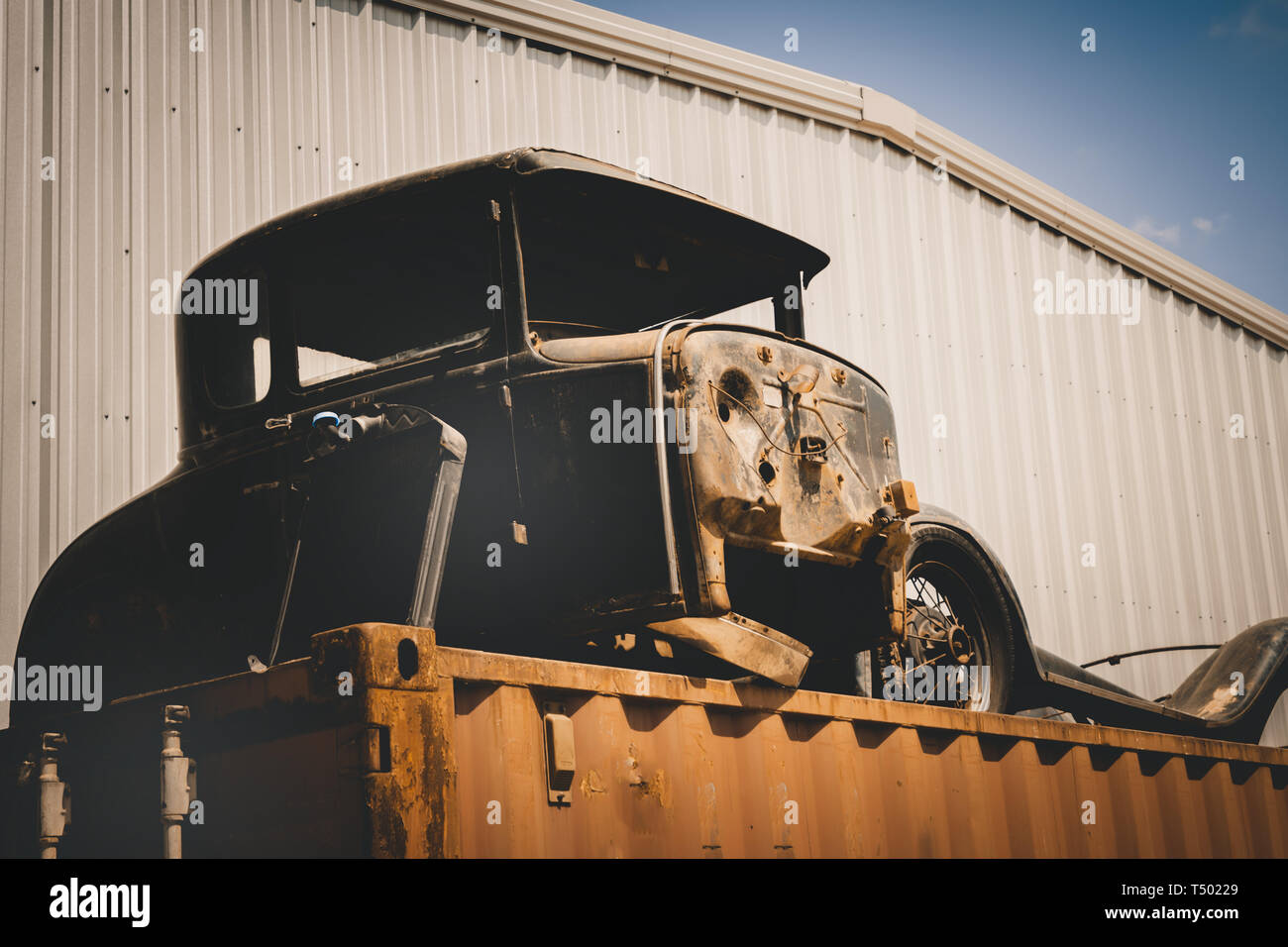 Old rusty vintage car abandoned Stock Photo - Alamy