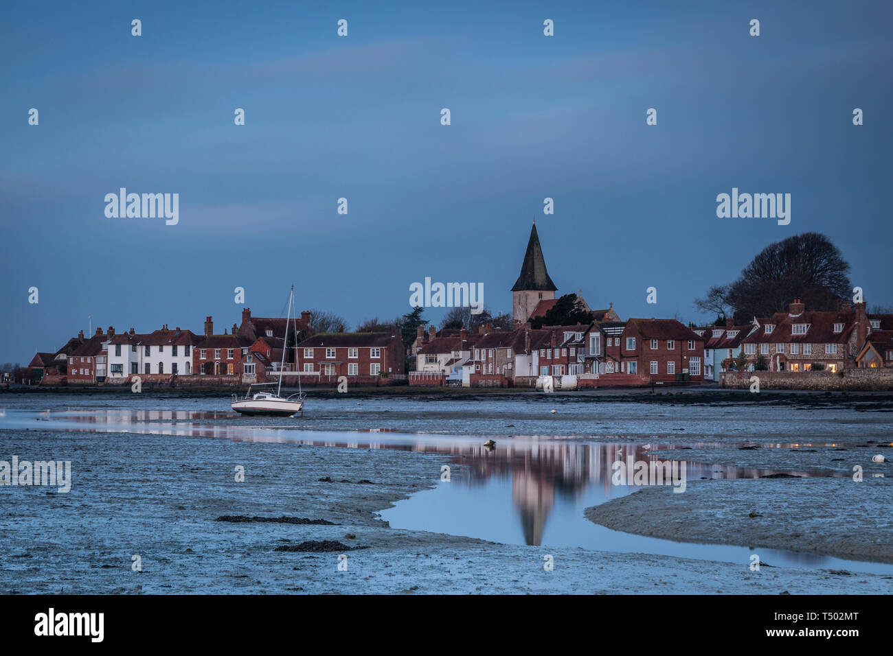 Sunrise at Bosham Quay with swan and steeple reflections Stock Photo ...