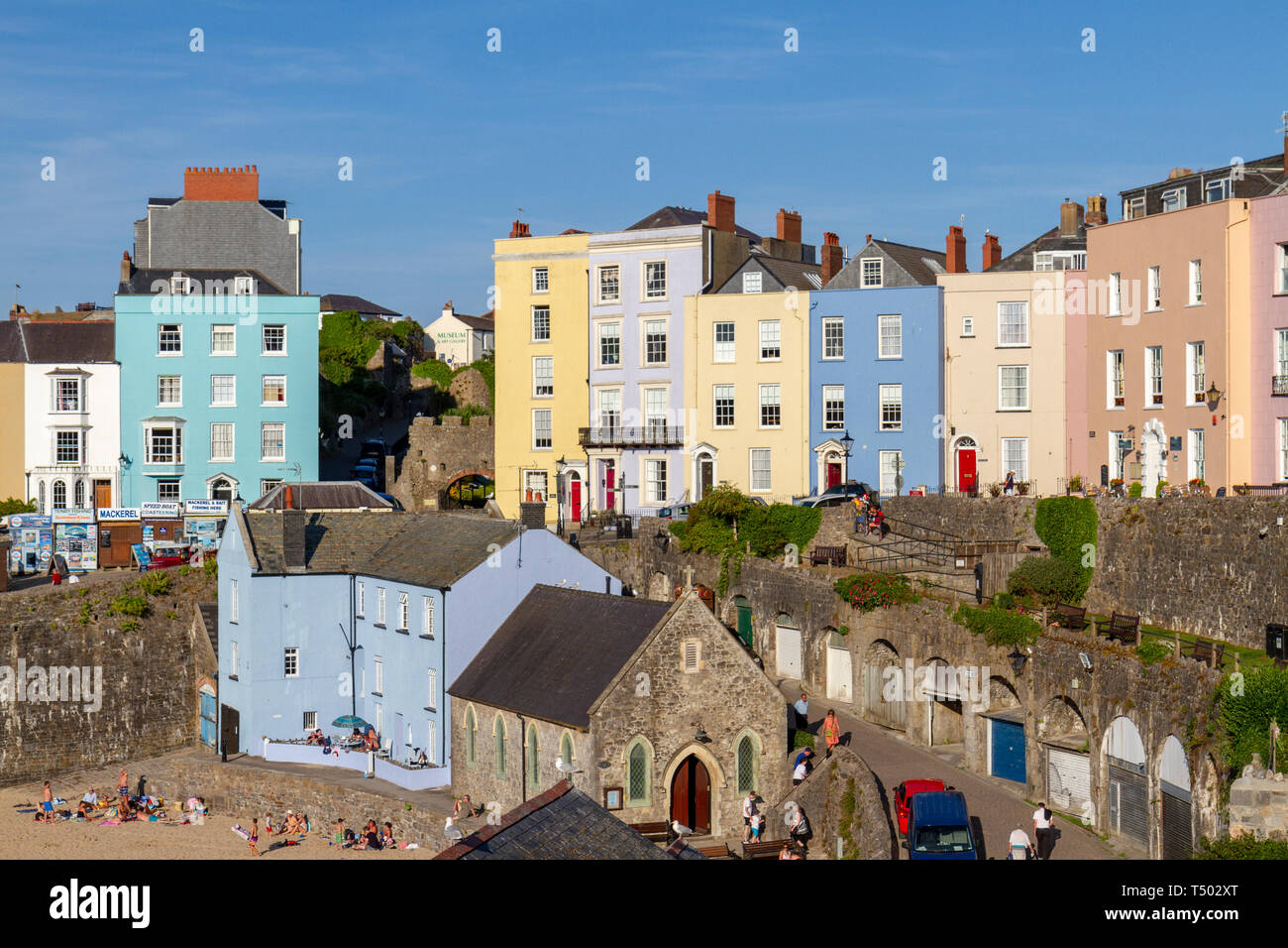 The colourful houses overlooking the pretty harbour in Tenby, Dyfed ...