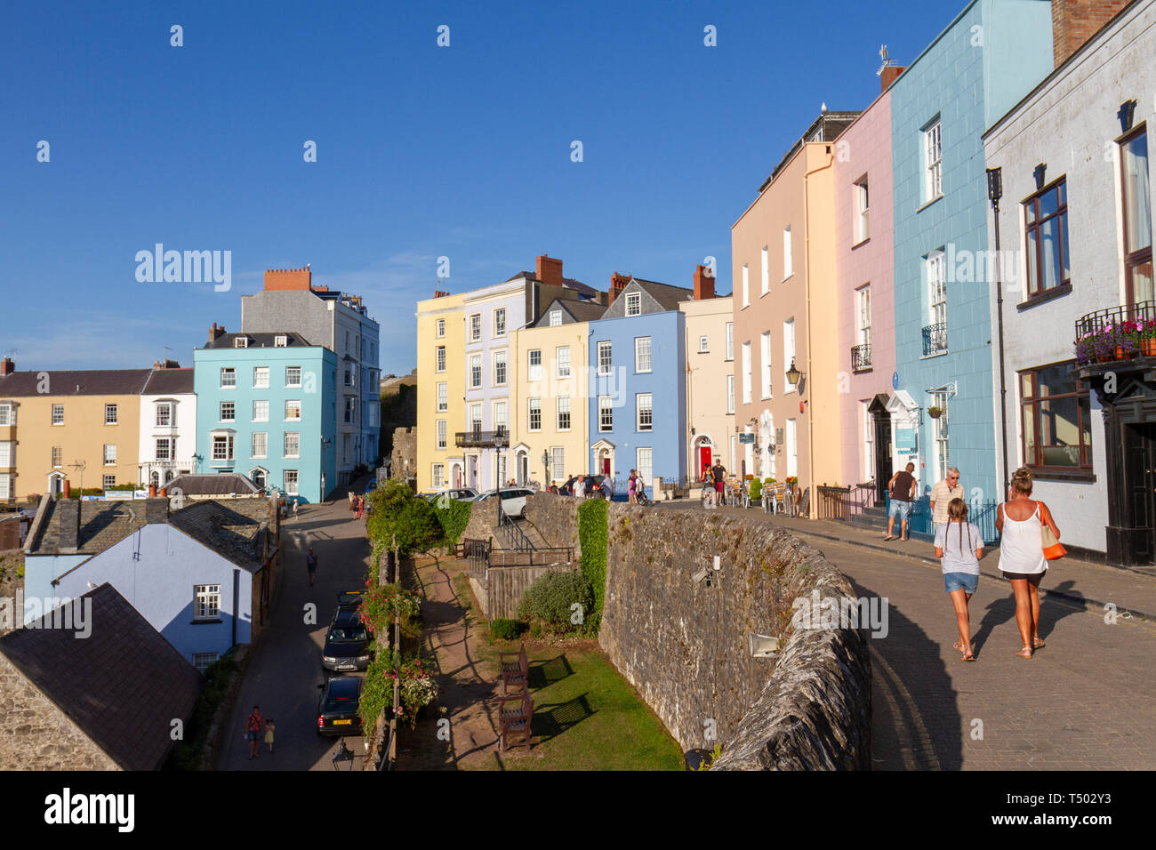 The colourful houses overlooking the pretty harbour in Tenby, Dyfed ...