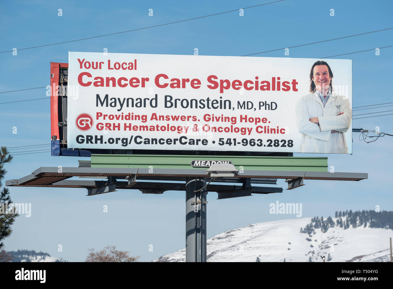 Billboard with ad for an oncologist in Eastern Oregon Stock Photo - Alamy