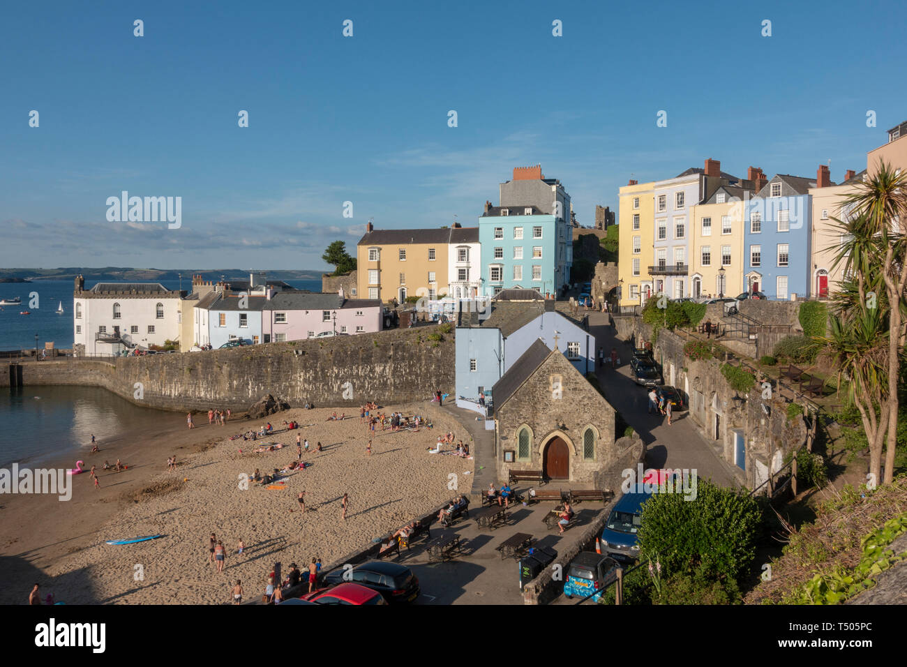 The colourful houses overlooking the pretty harbour in Tenby, Dyfed ...