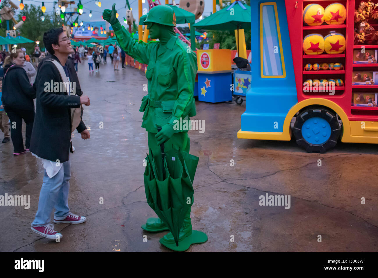 Orlando, Florida. March 29, 2019. Toy Story Soldier greets a nice ...
