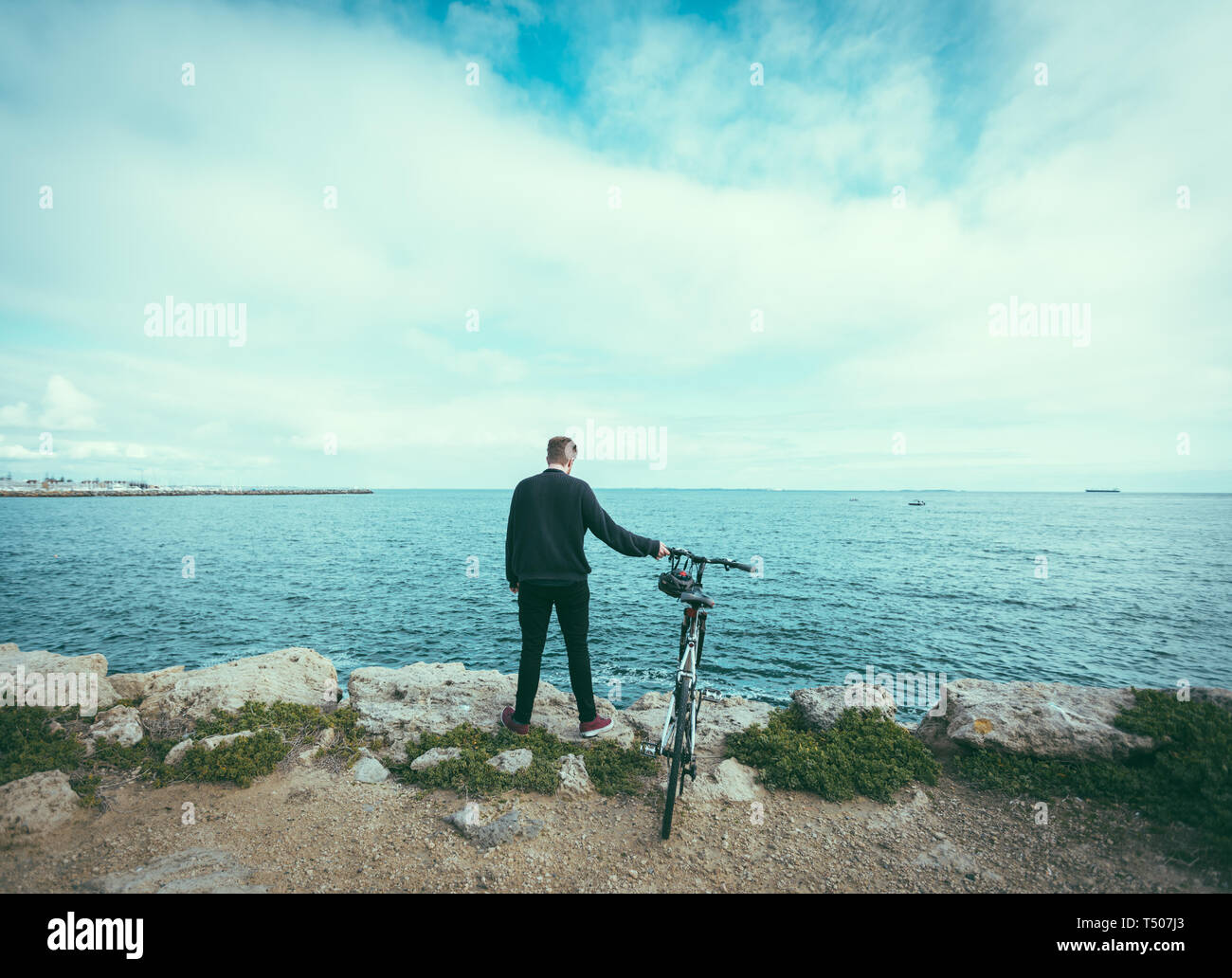 man holding bike Stock Photo - Alamy