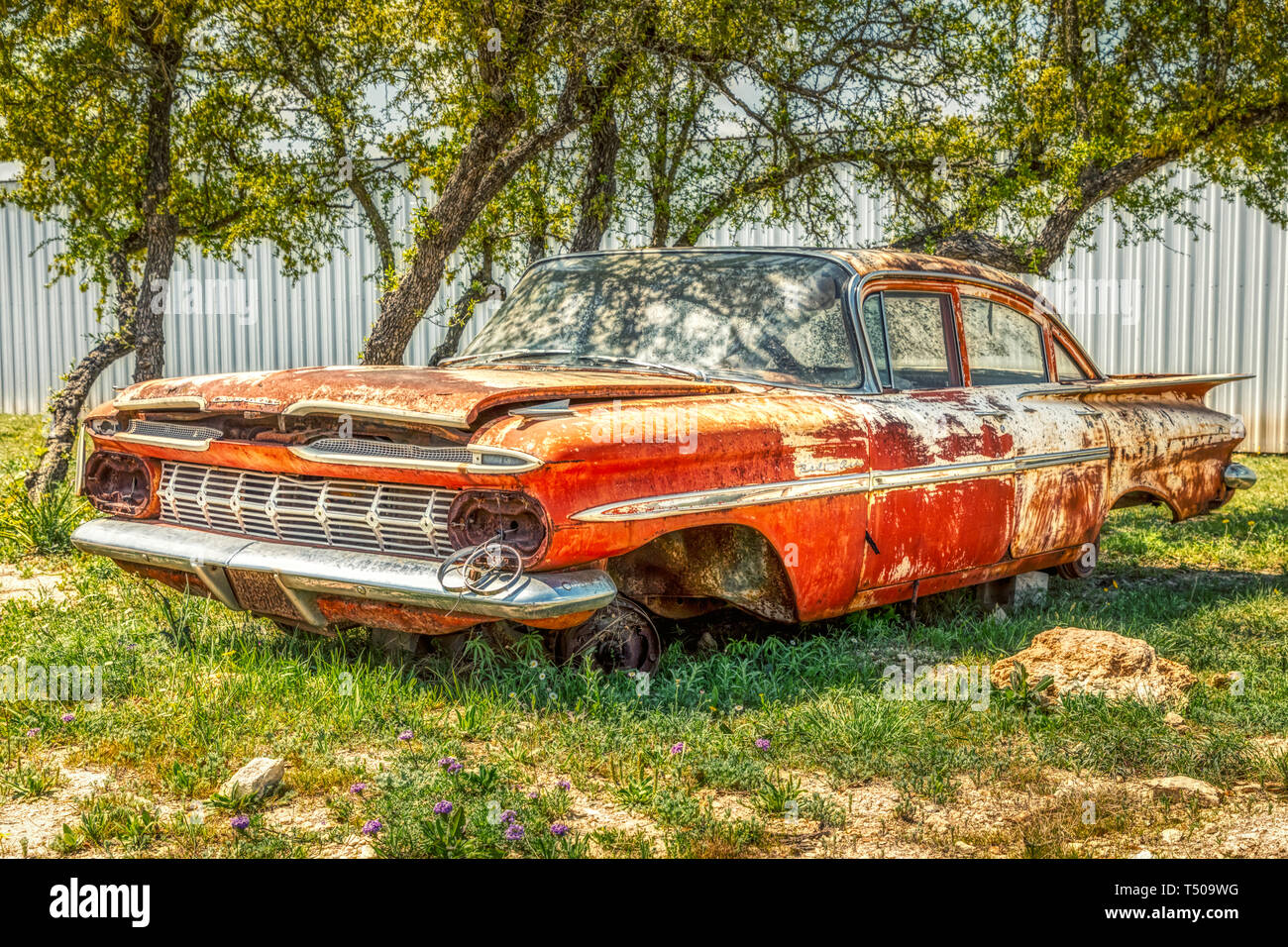 Old rusty vintage car abandoned Stock Photo - Alamy