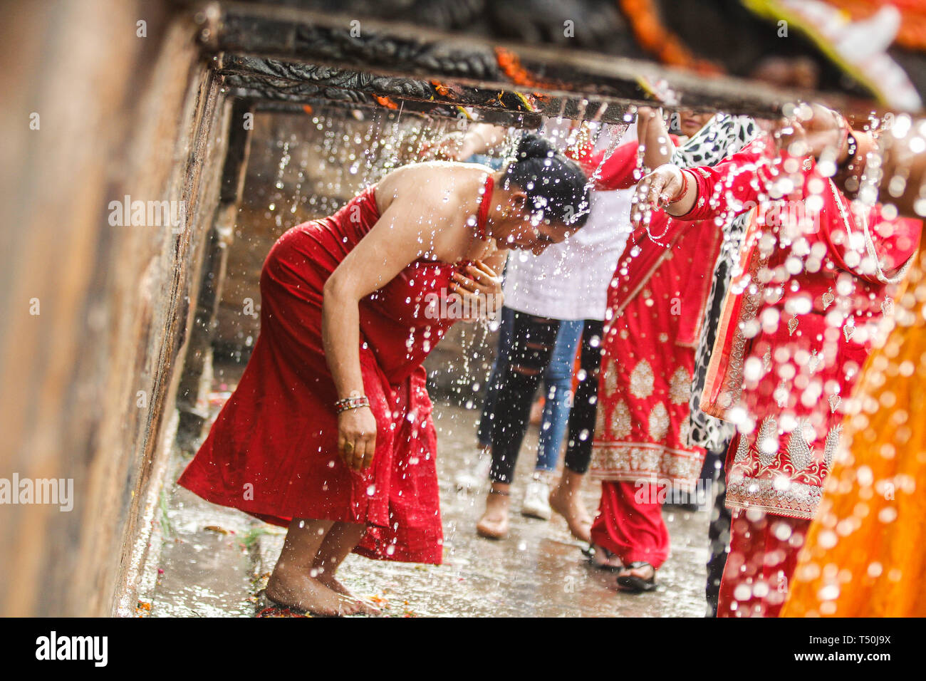 Woman takes holy bath in hi-res stock photography and images - Alamy