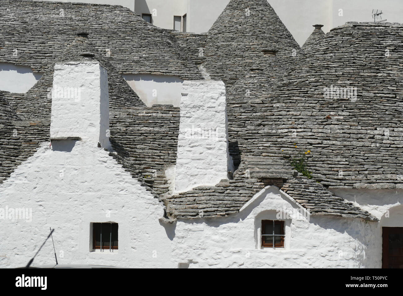 Stone coned rooves of trulli houses in Alberobello, Puglia, Italy Stock ...
