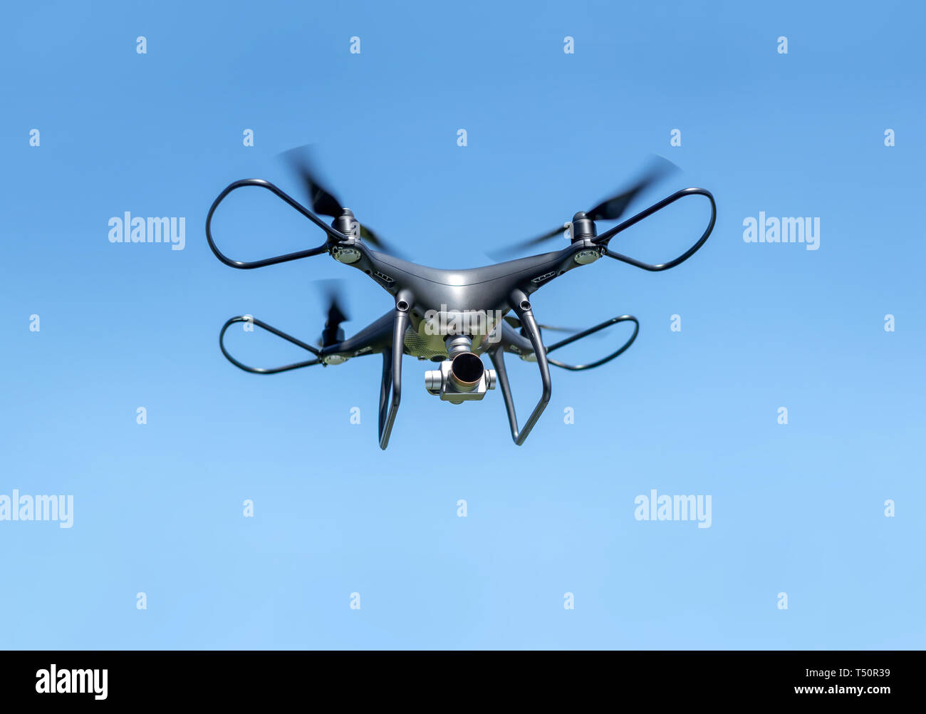 Drone in the sky. Unmanned aerial vehicle flying in the air Stock Photo ...