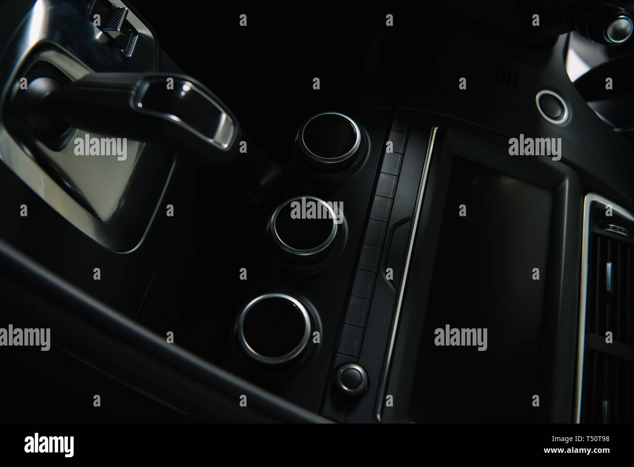 black buttons near modern car dashboard and gear shift in automobile ...