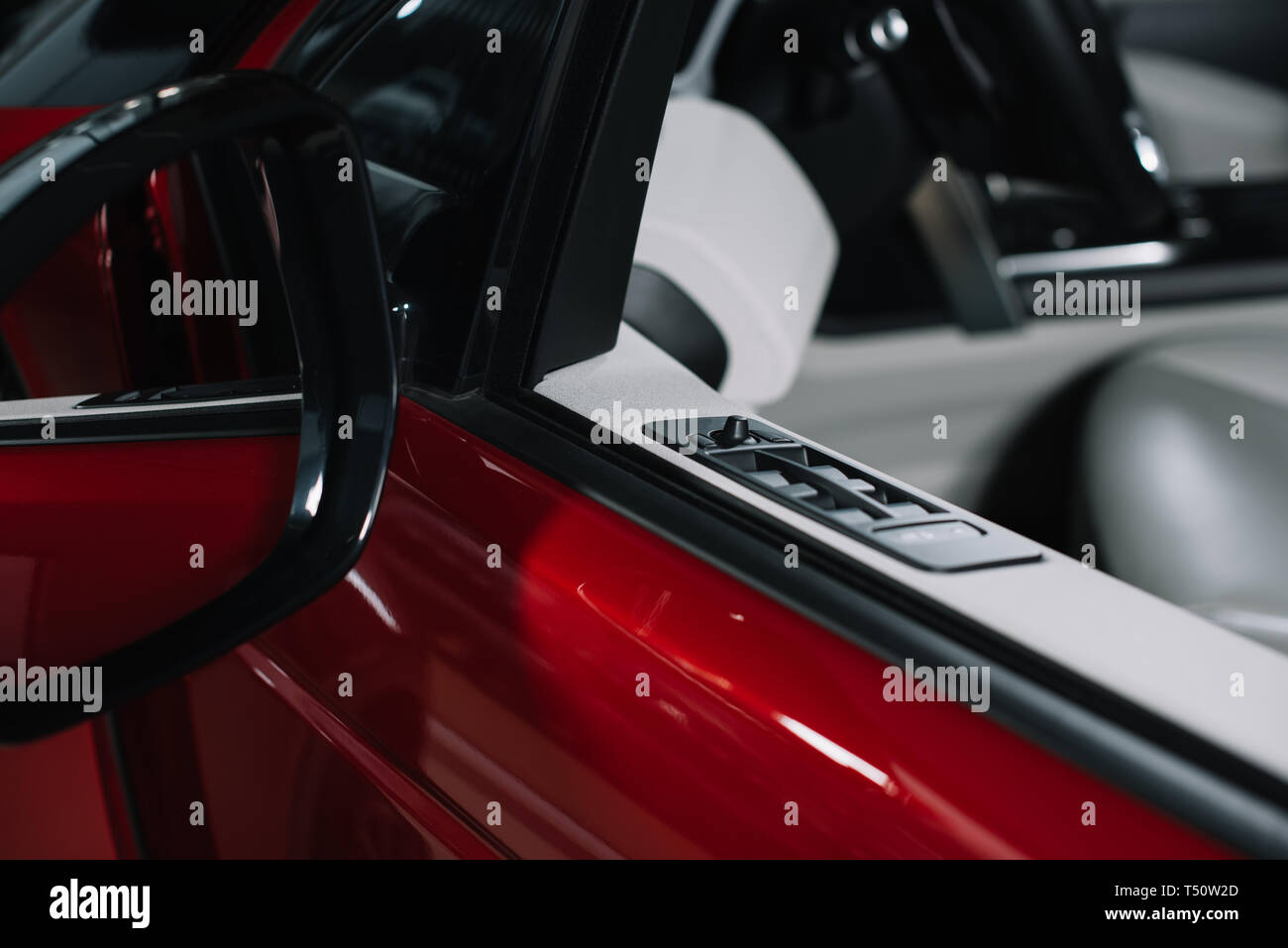 car mirror near door with buttons in red automobile Stock Photo - Alamy