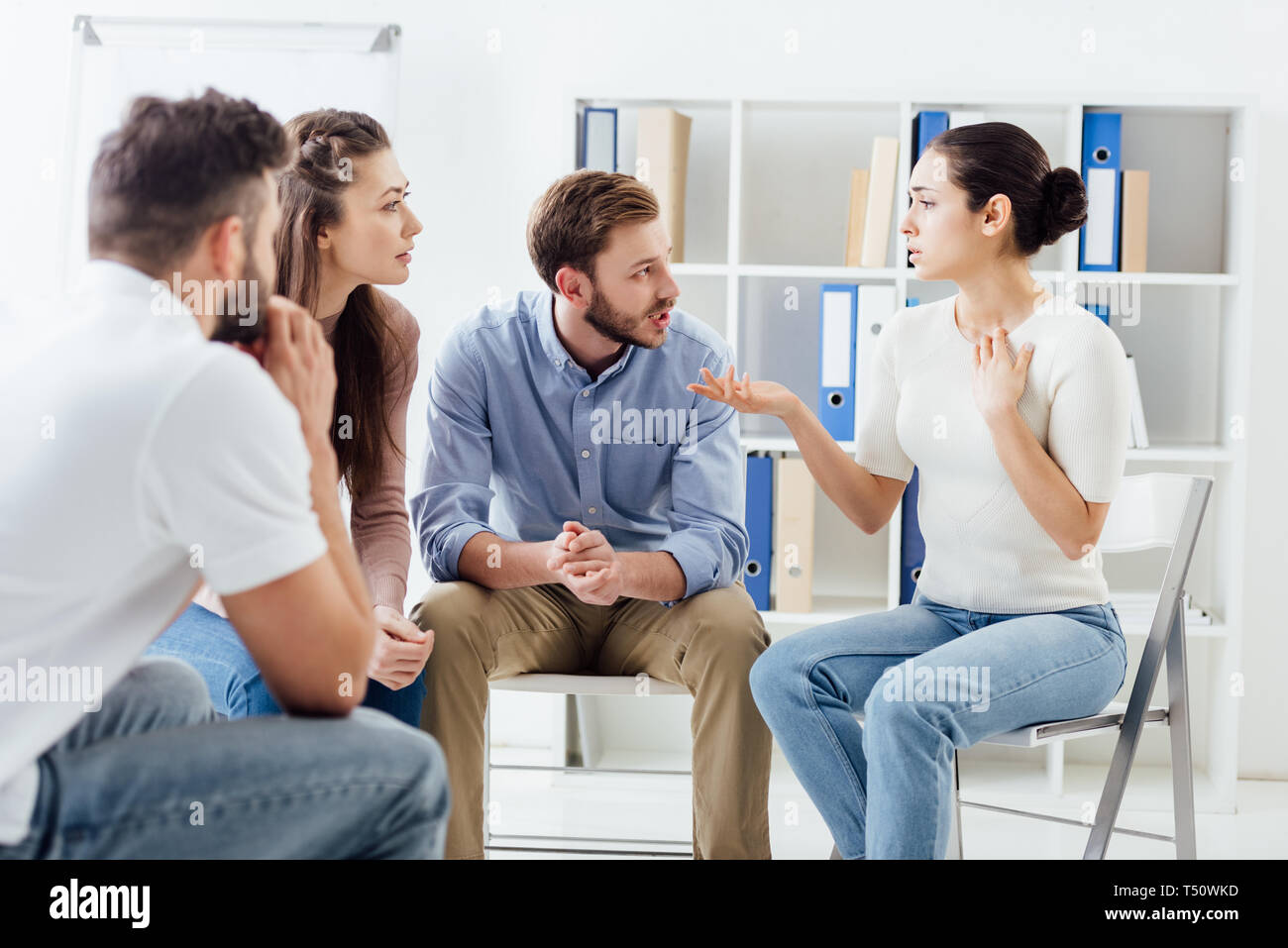 people sitting and having discussion during group therapy meeting Stock ...