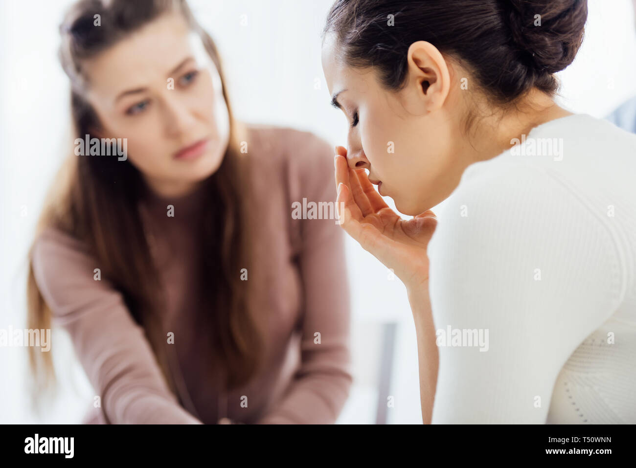 Woman crying during therapy session hi-res stock photography and images ...