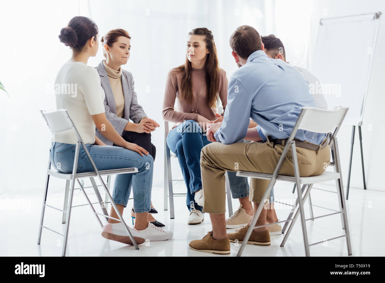 people sitting in circle during support group therapy meeting Stock ...