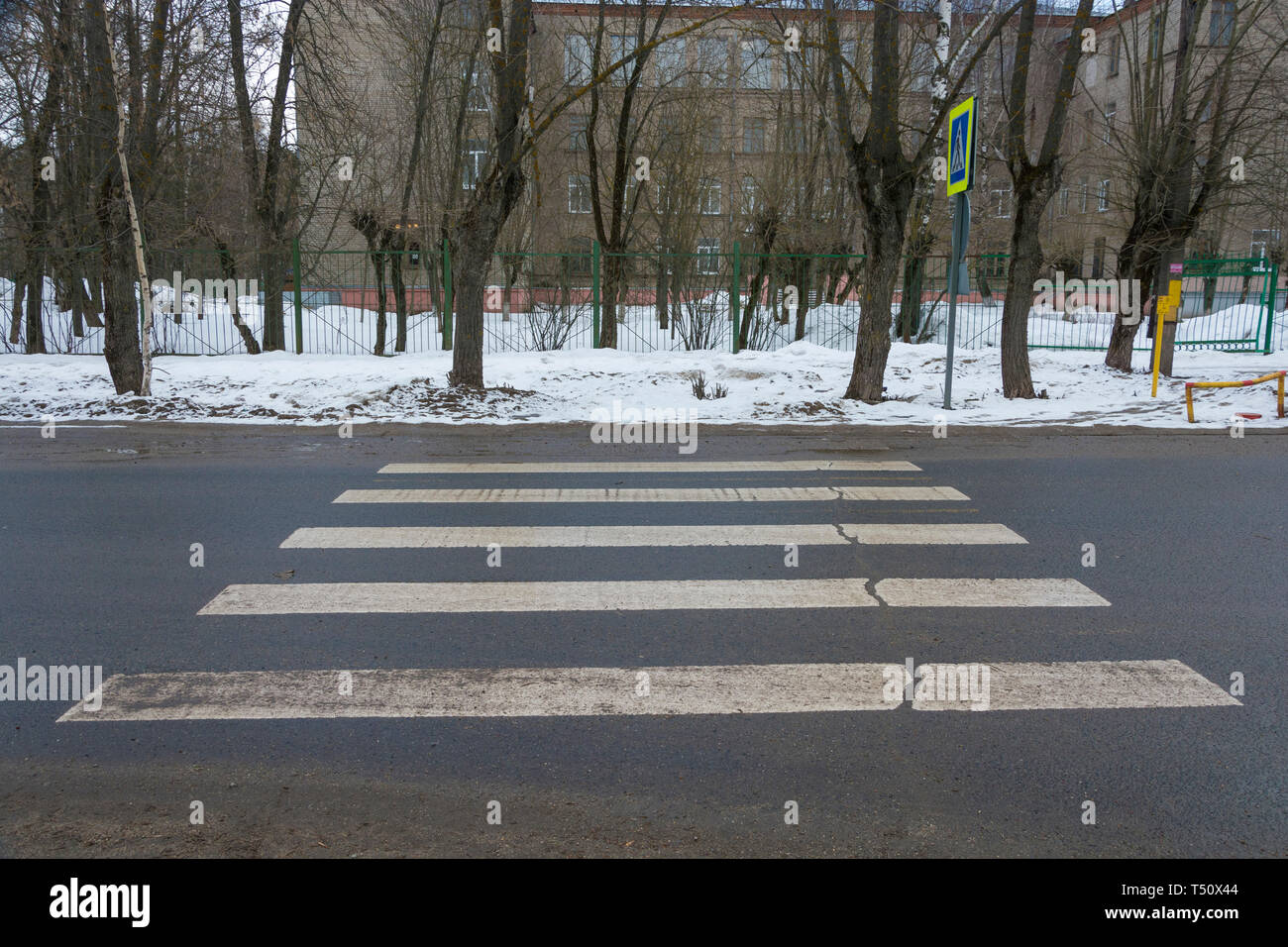 Incorrectly designed pedestrian crossing on an asphalt road, resting on ...