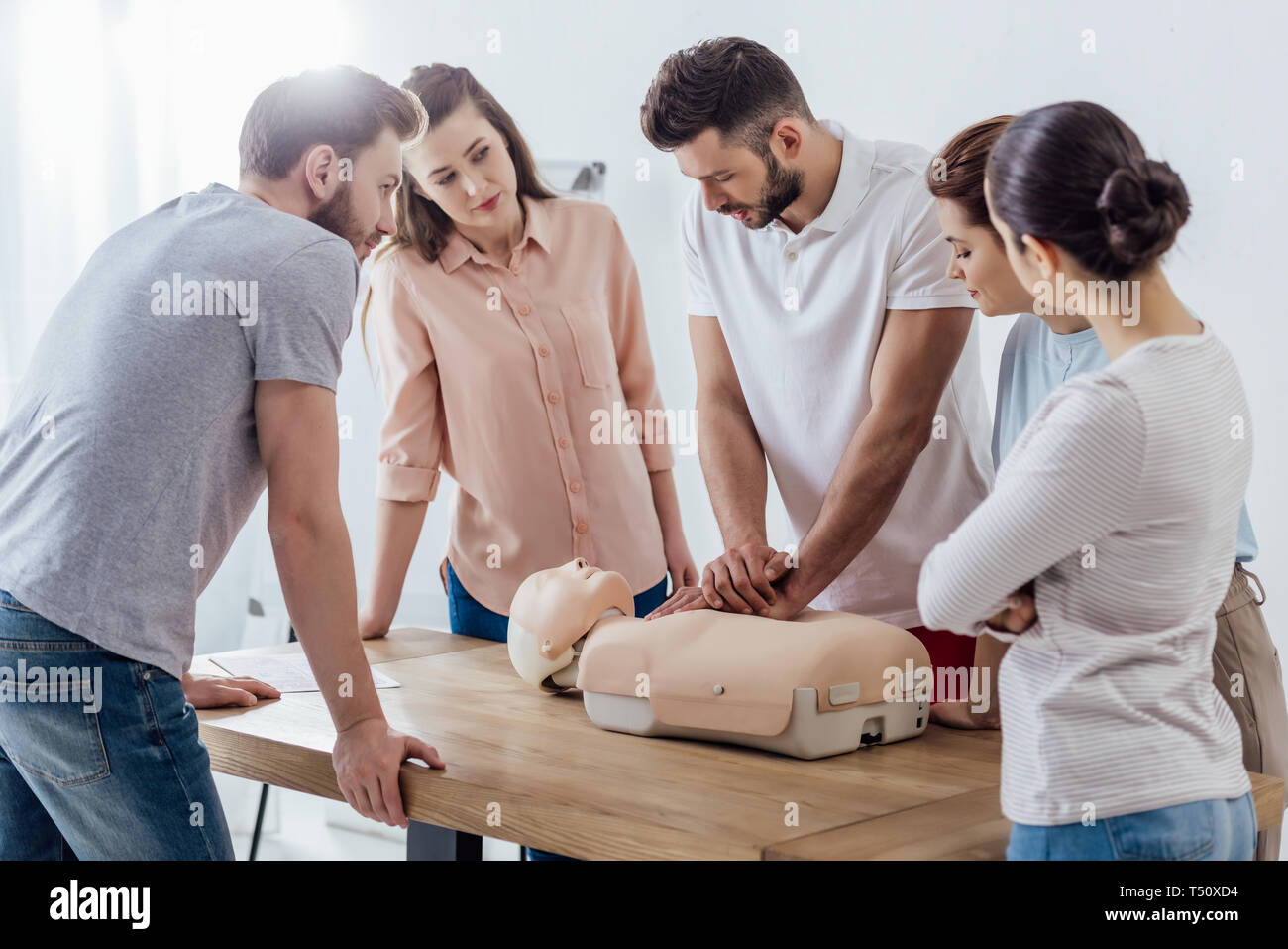 Man performing first aid hi-res stock photography and images - Alamy