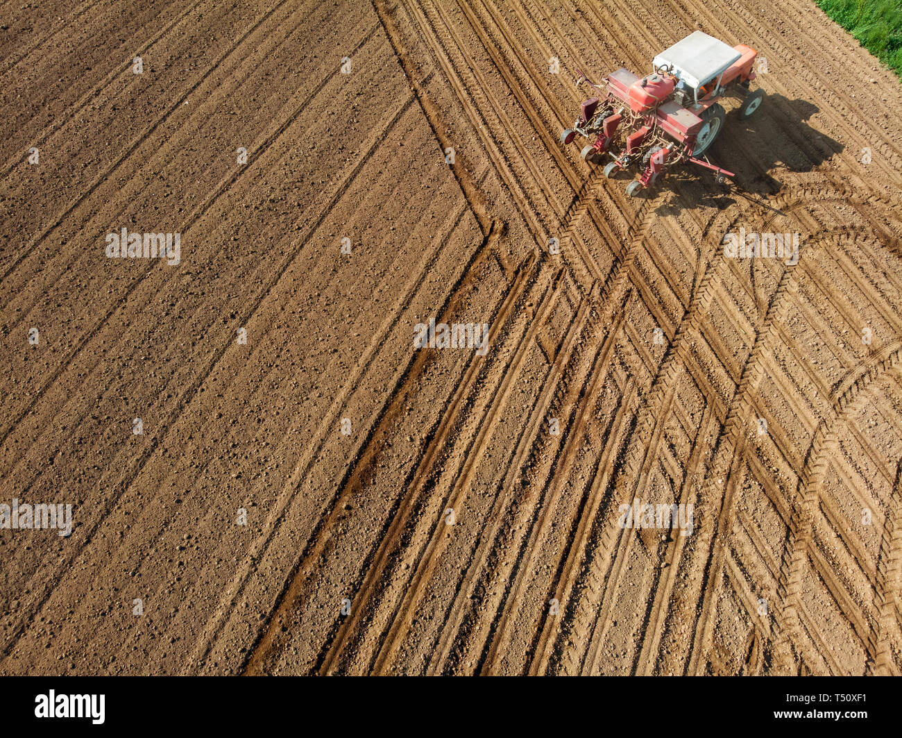 Aerial view of a tractor plowing the fields, plowing, sowing, harvest ...
