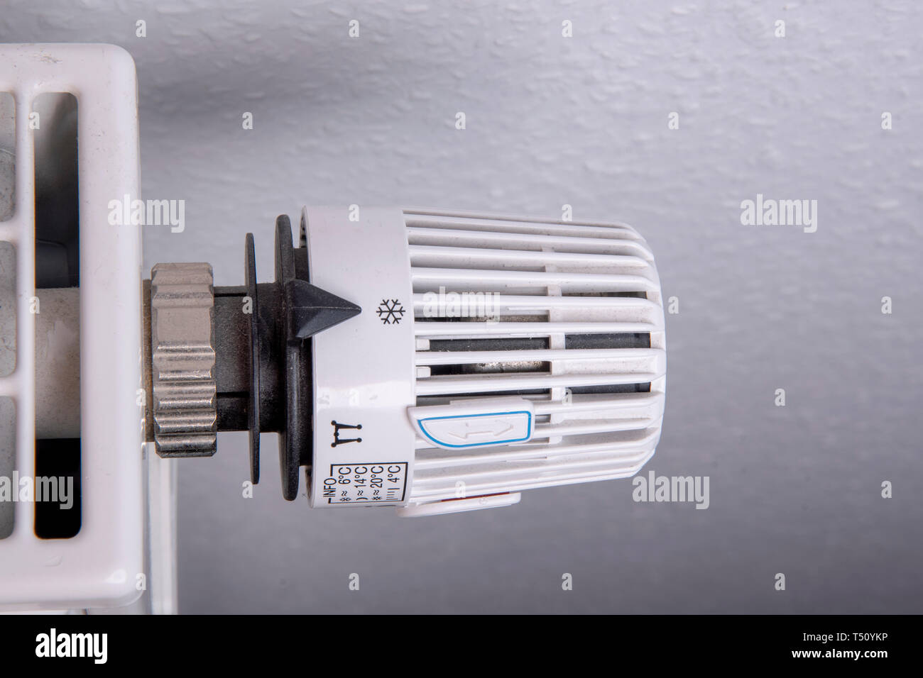 Thermostat on one radiator turned up Stock Photo - Alamy