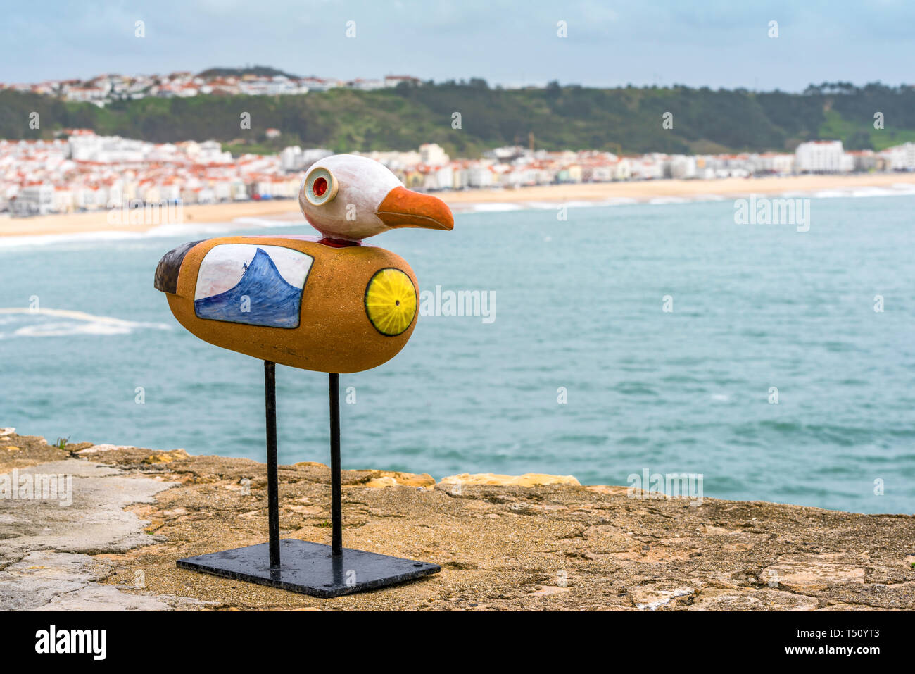 Cute bird statue at Nazare beach, Portugal Stock Photo - Alamy