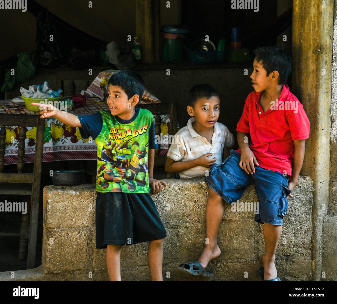 three latin children together in Guatemalan village Stock Photo - Alamy
