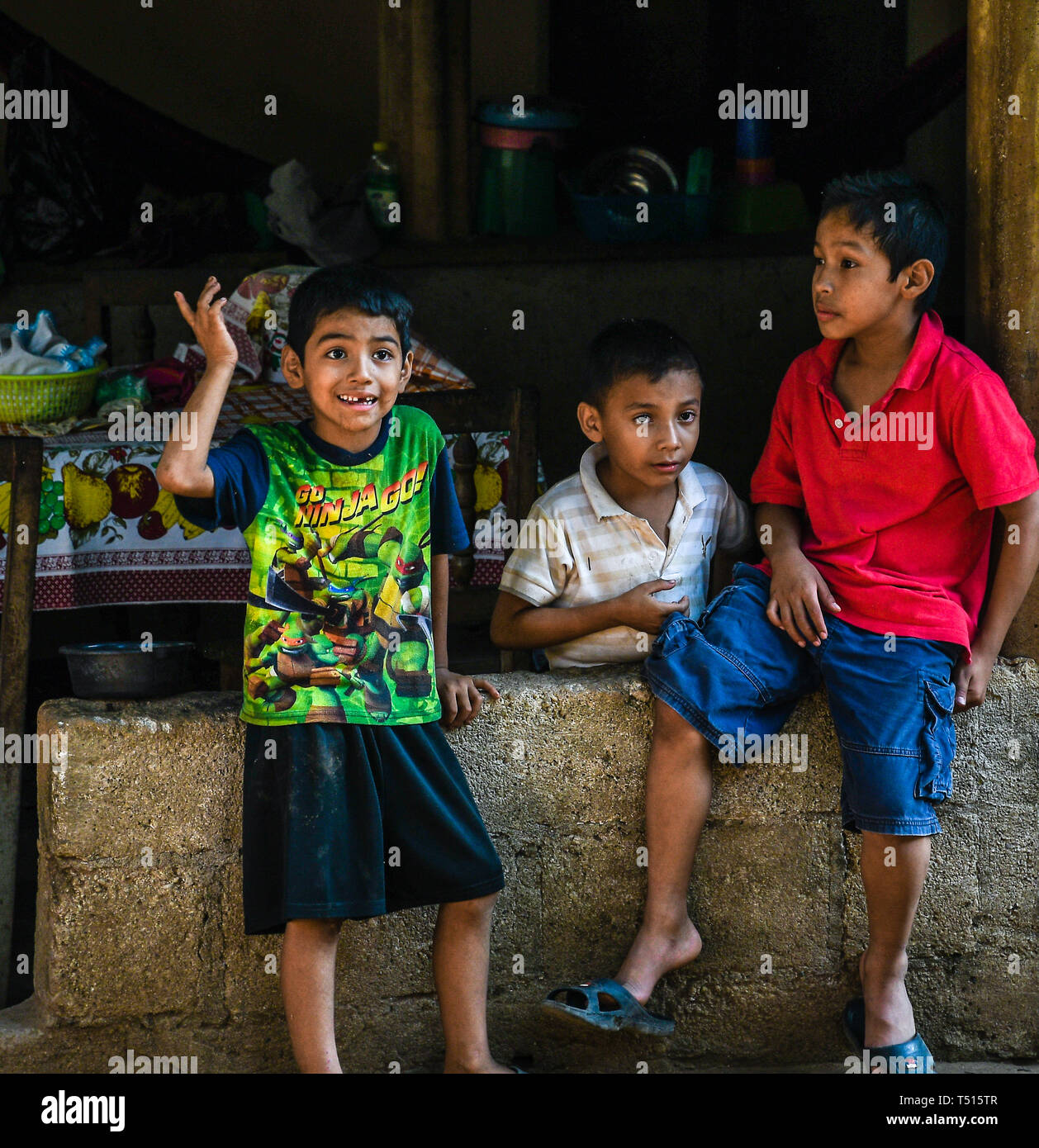 three latin children together in Guatemalan village Stock Photo - Alamy