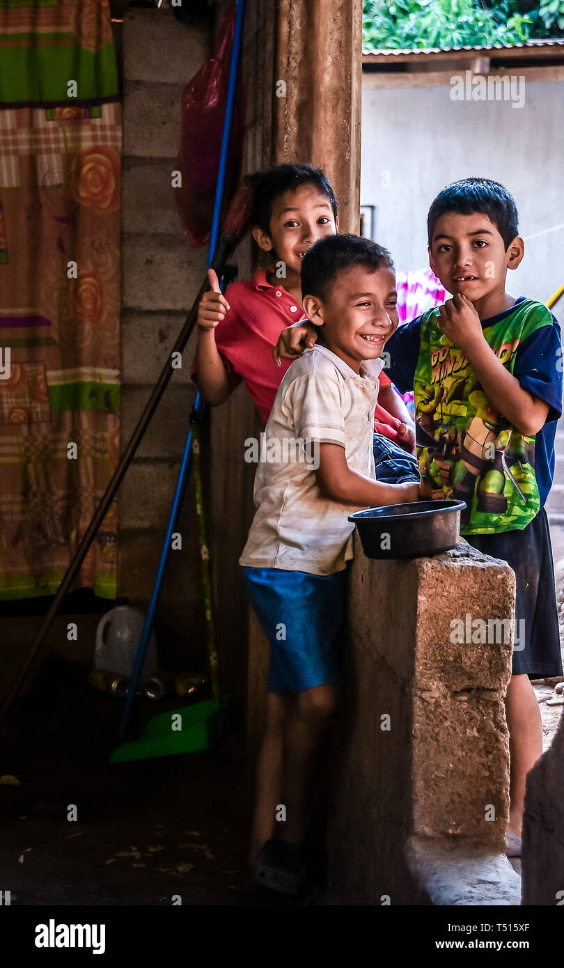 three latin children together in Guatemalan village Stock Photo - Alamy