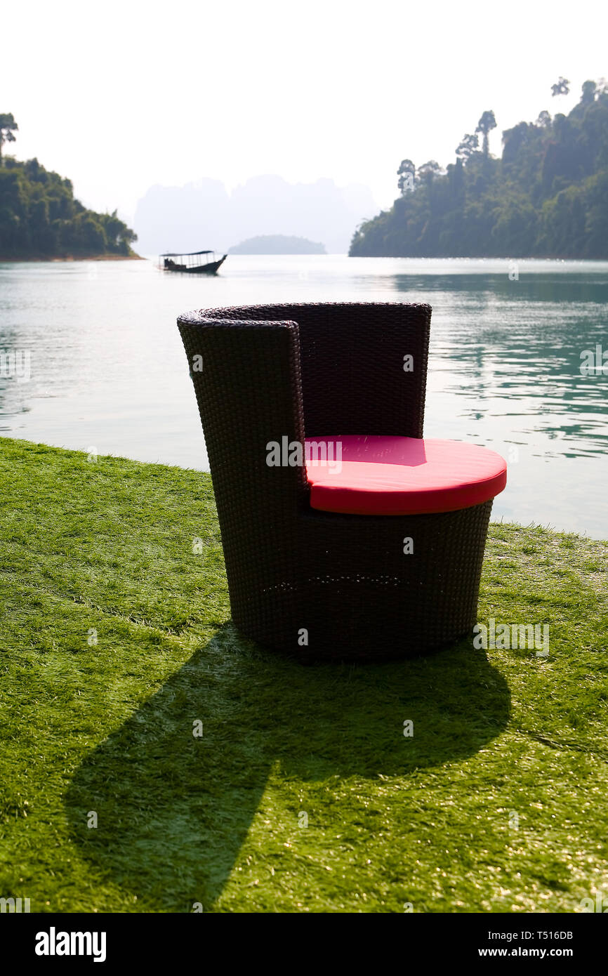 The armchair stands on the shore of the lake Cha Long, in the ...