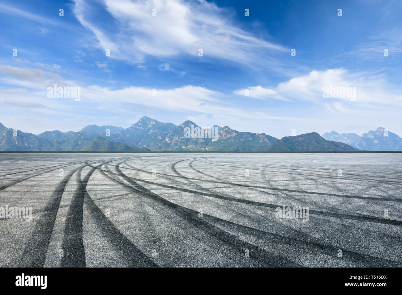 Asphalt race track ground and mountain with clouds background Stock ...