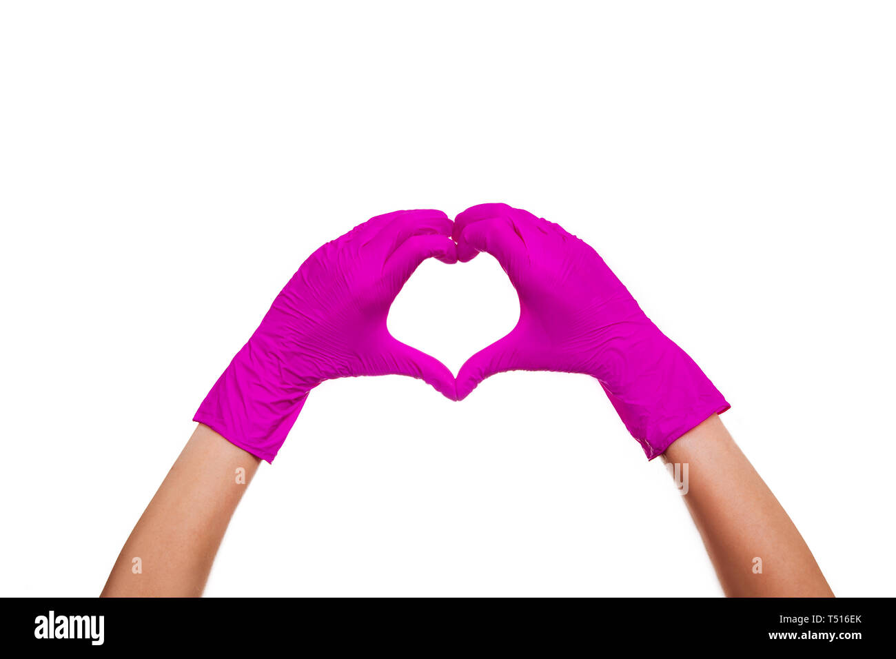 Hand in pink medical glove showing heart sign. Isolated on a white ...