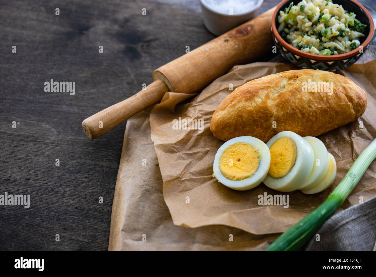 Traditional georgian pies with eggs, rice and green onion on dark ...