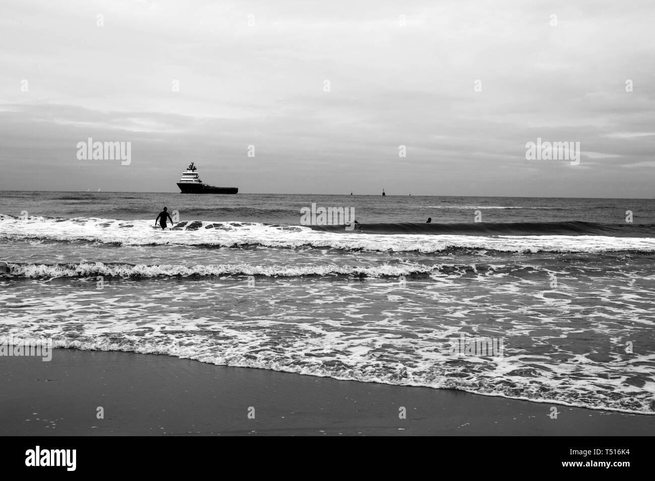 A black and white shot with a melancholy mood. The beach of the ...