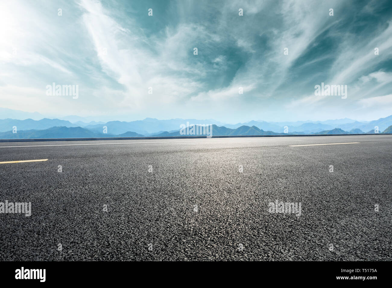 Empty asphalt road and mountains with beautiful clouds landscape Stock ...