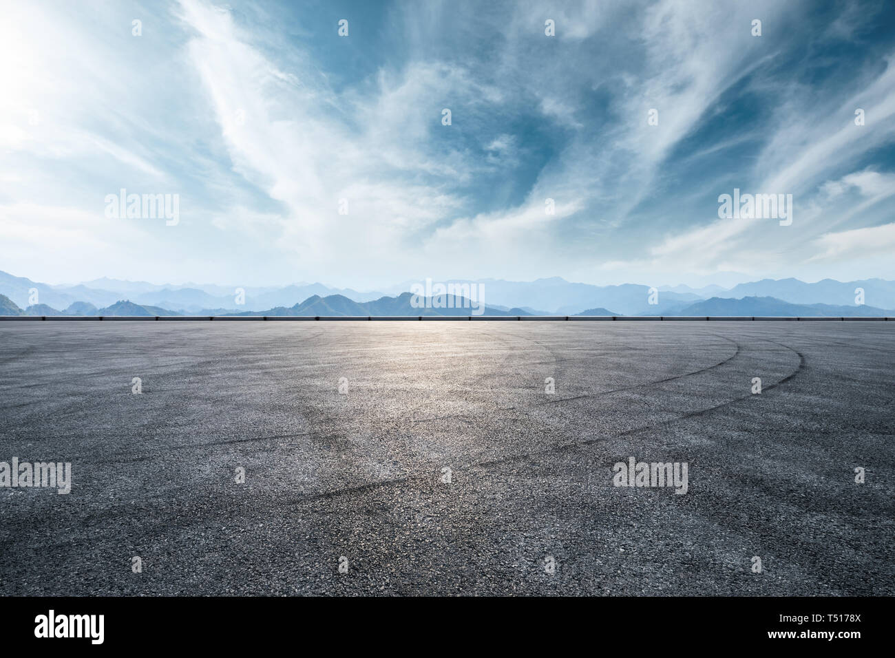 Asphalt race track ground and mountain with clouds background Stock ...