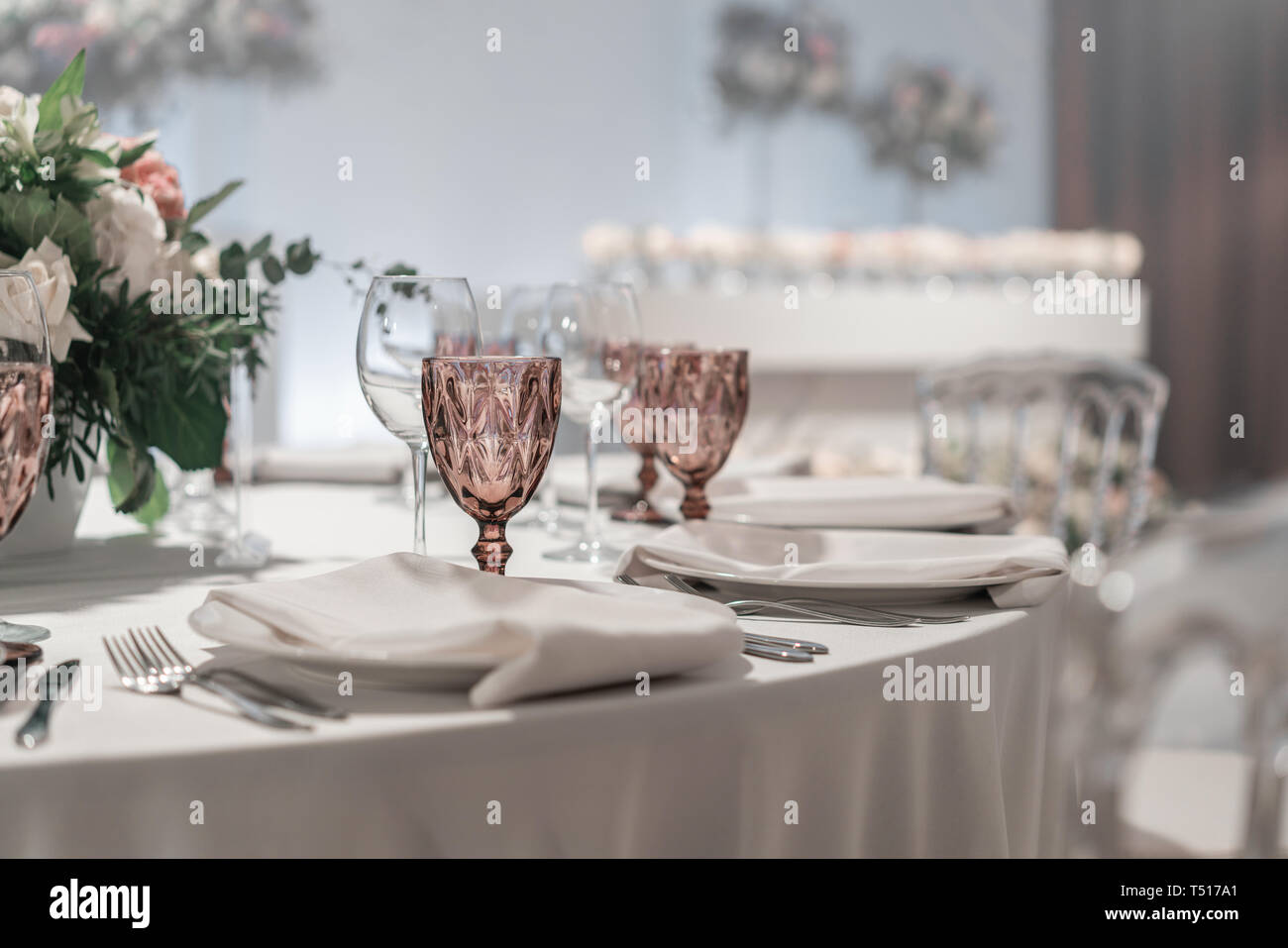 Glasses of wine on round Banquet table served. Interior of restaurant ...