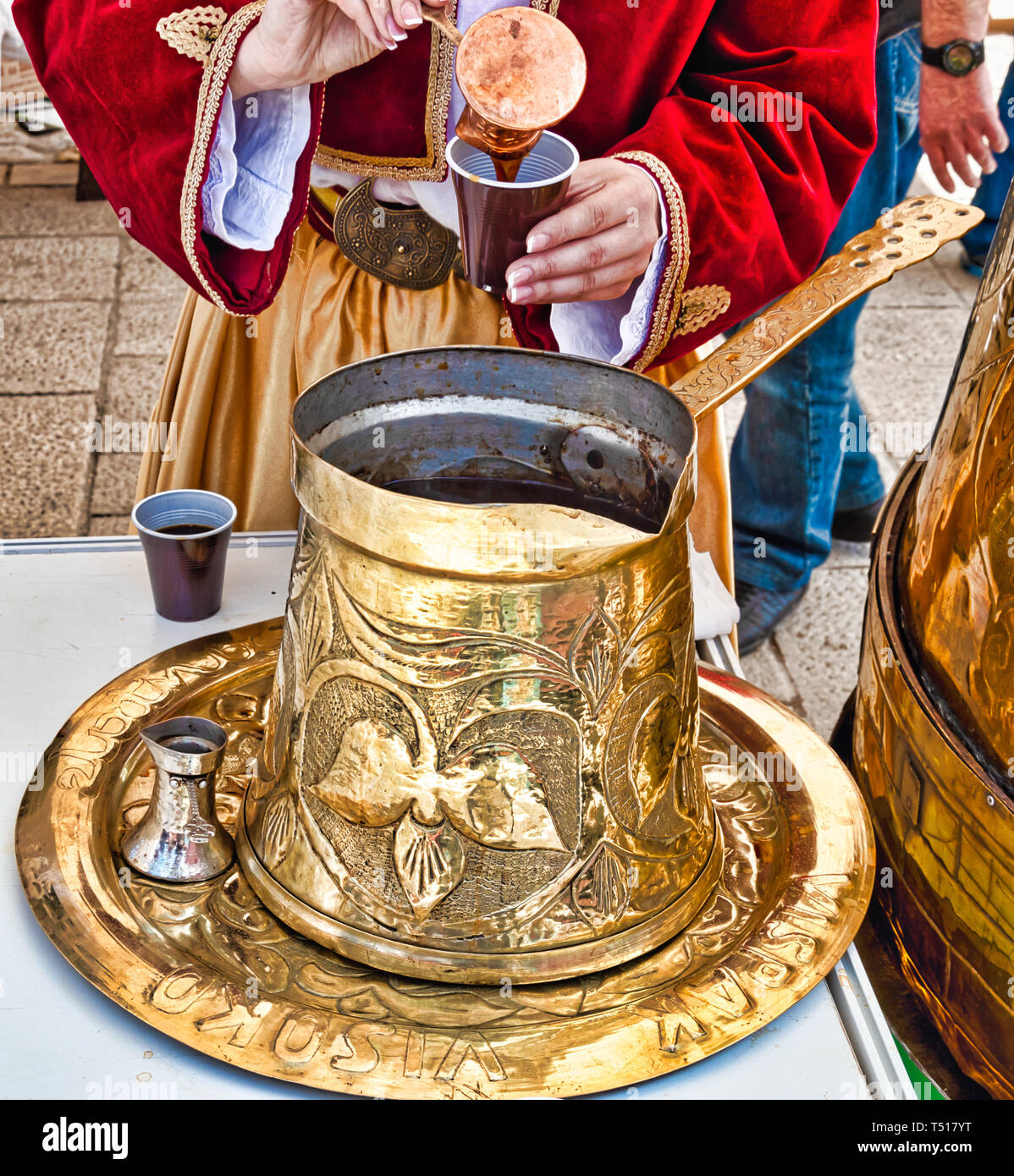 Serving Bosnian coffee from big dzezva Stock Photo - Alamy